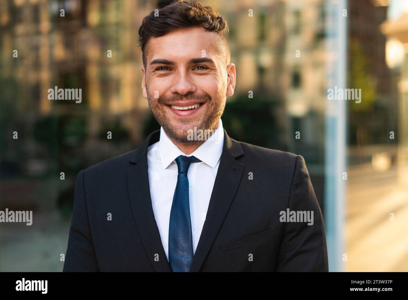Portrait outdoors business man smiles Stock Photo - Alamy