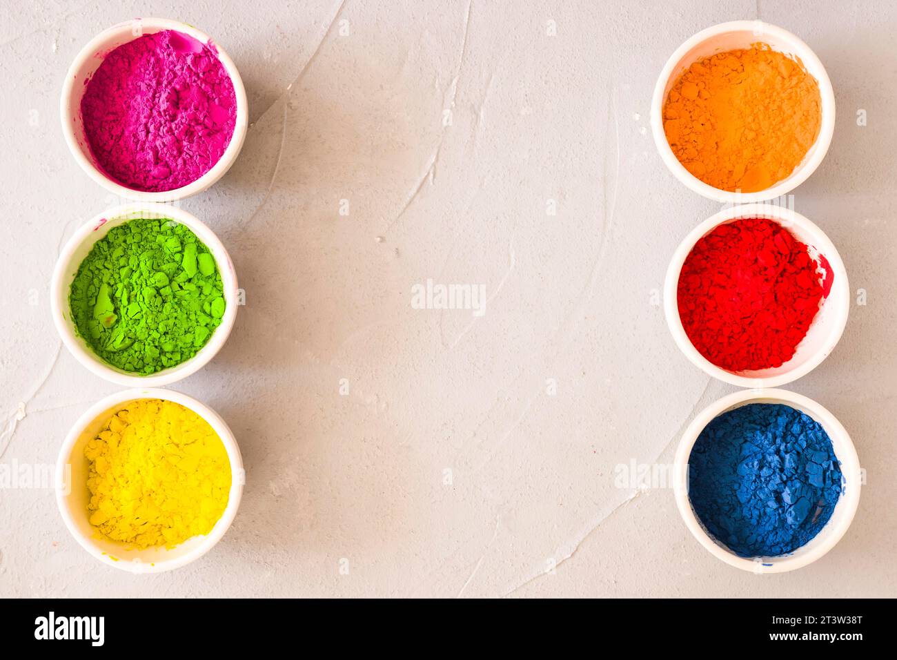 Row holi color powder white bowls textured backdrop Stock Photo - Alamy