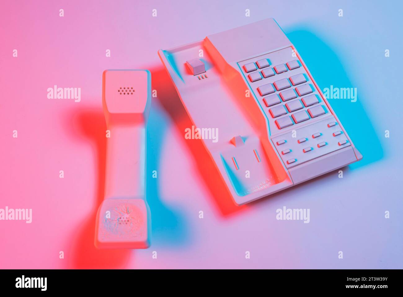 Receiver landline telephone pink background with blue shadow Stock ...