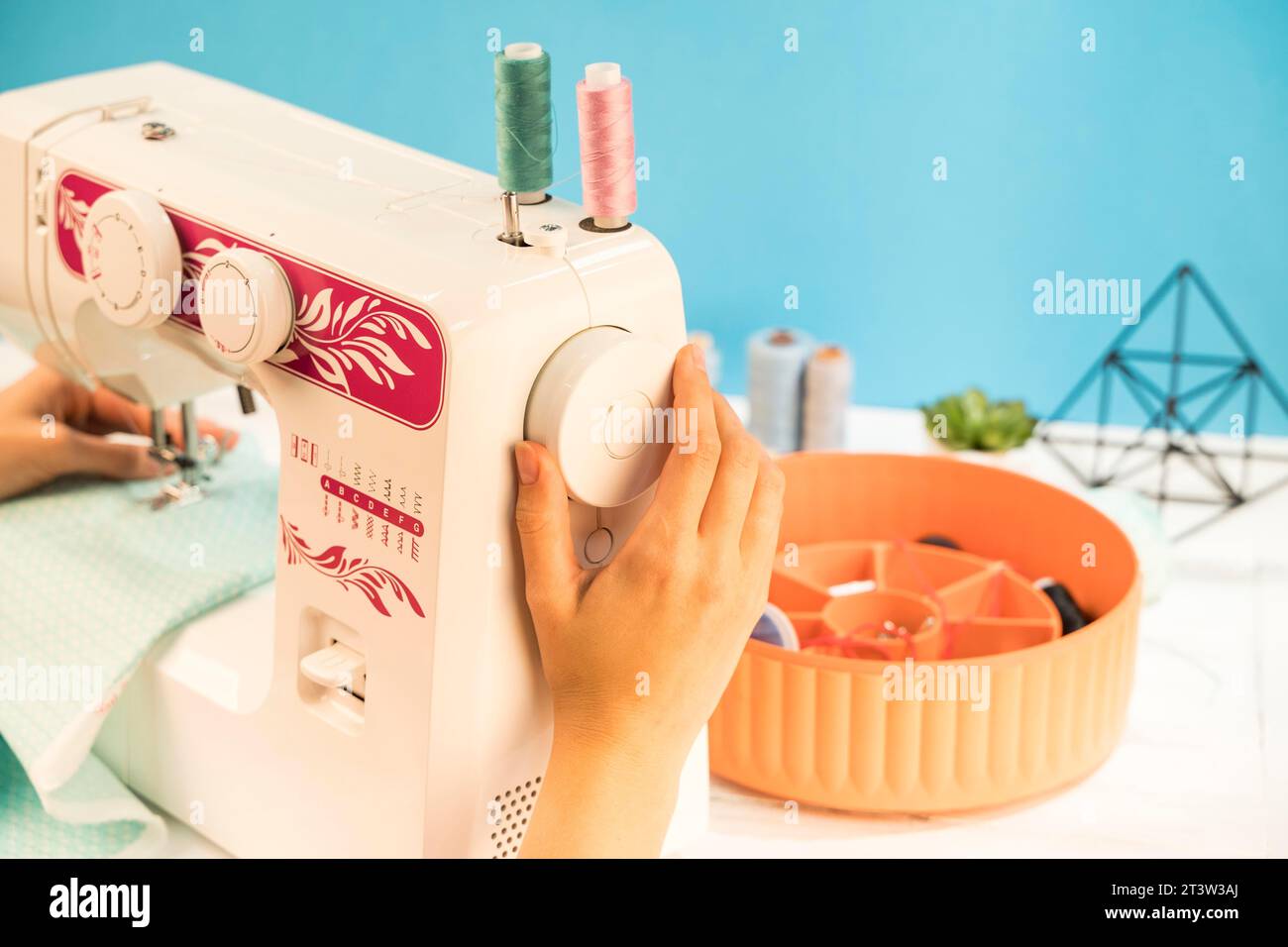 Sewing machine with blue background Stock Photo - Alamy