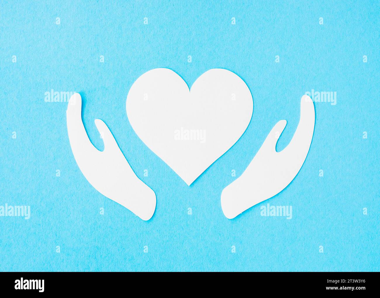 Top view paper heart with paper hands Stock Photo - Alamy