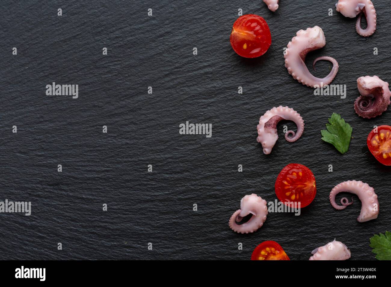 Top view octopus pieces with vegetables Stock Photo - Alamy