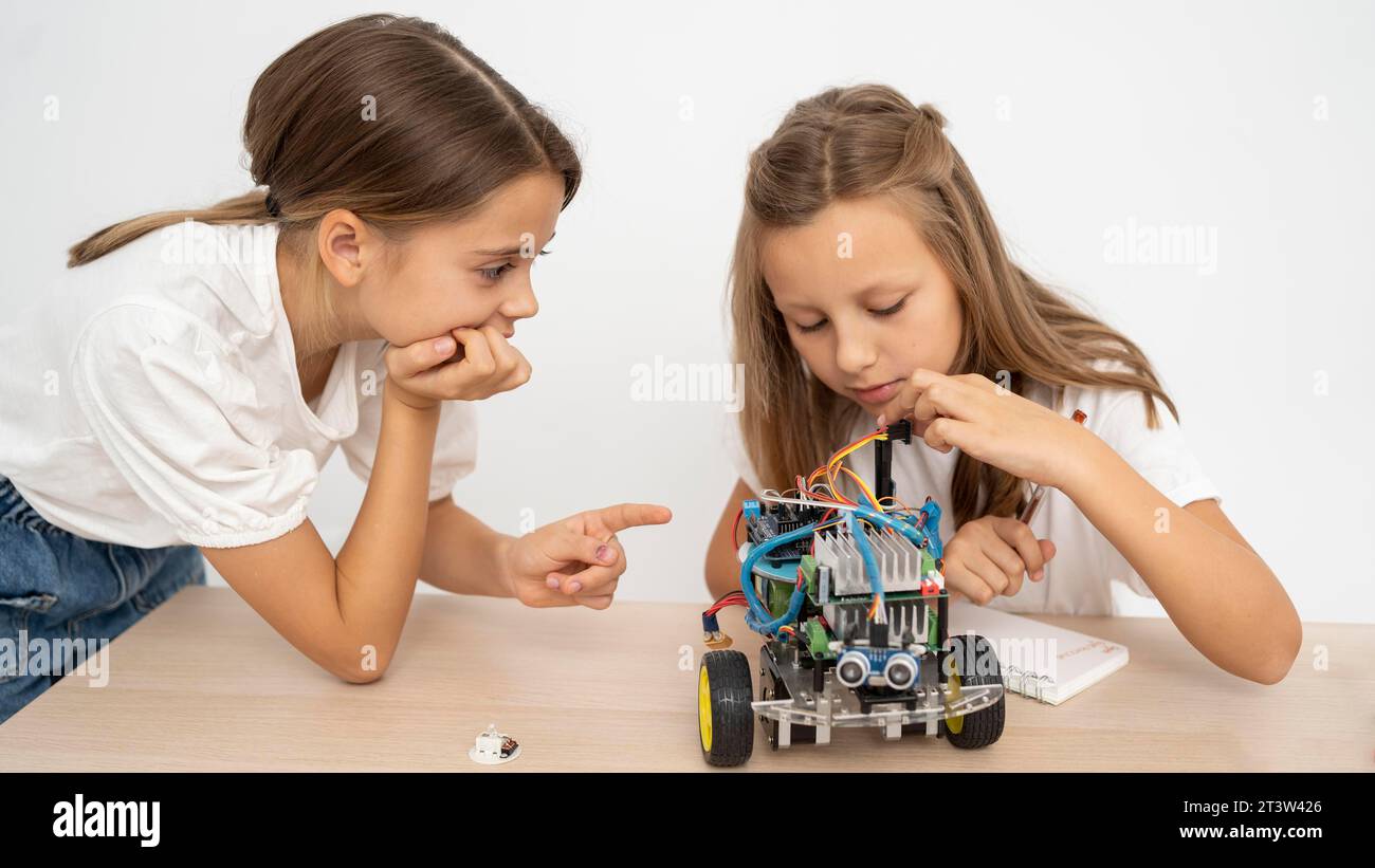 Two girls doing science experiments together Stock Photo - Alamy