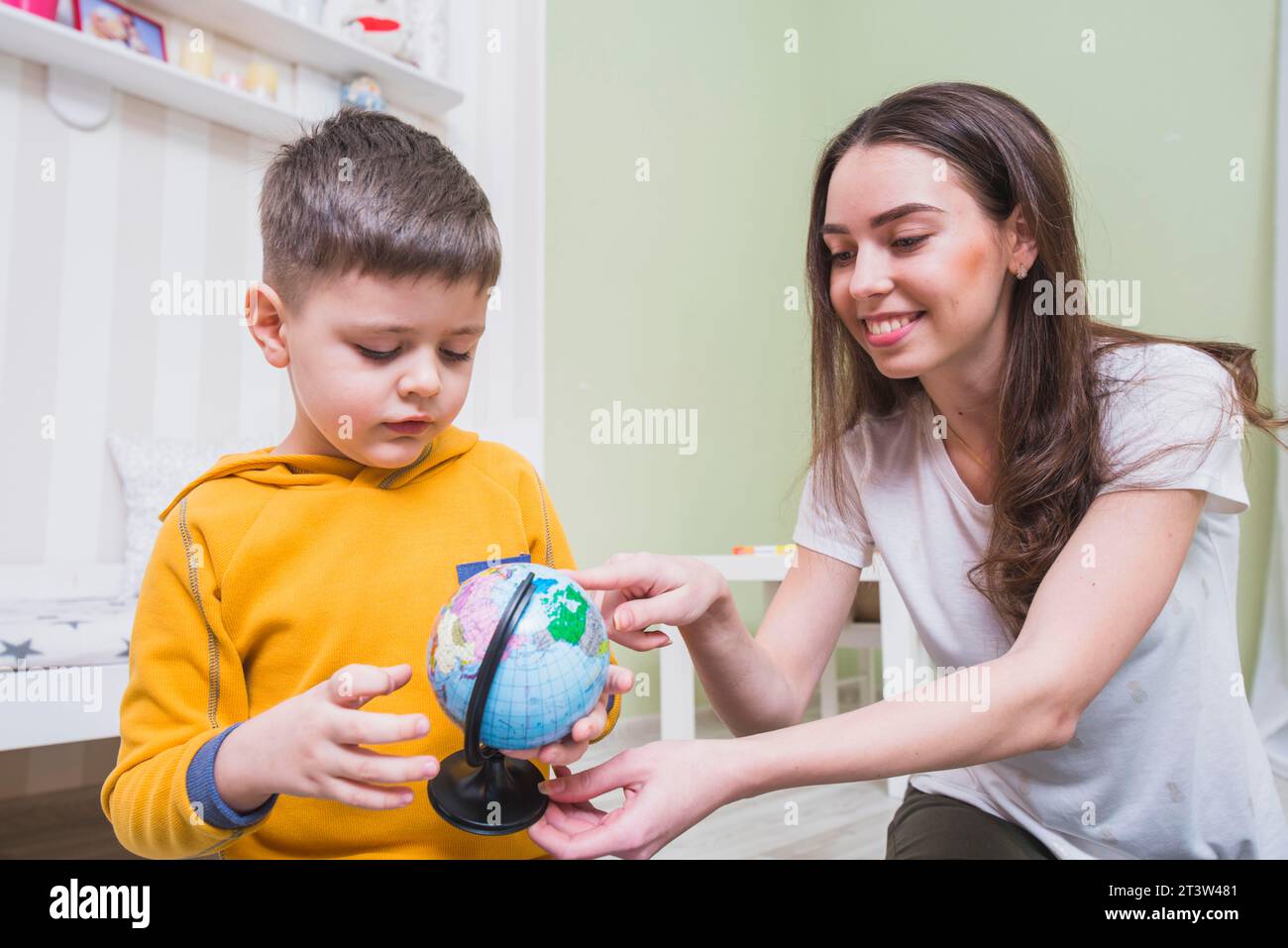 Young mother teaching son Stock Photo - Alamy