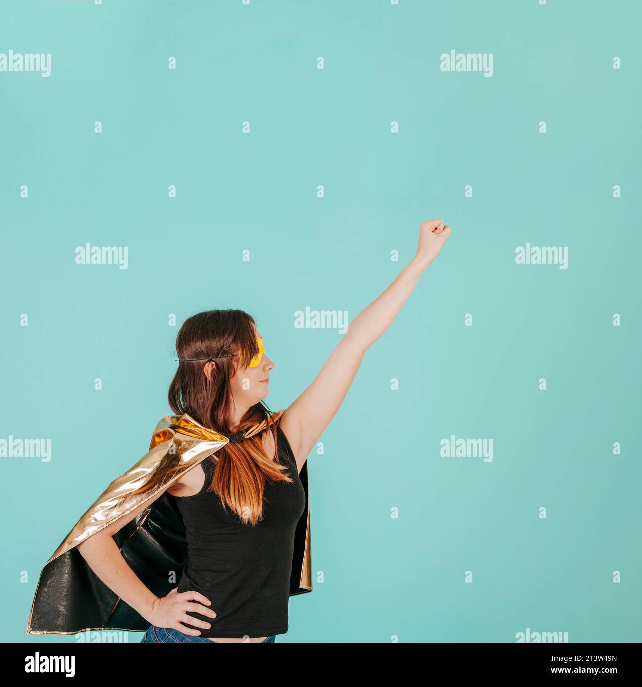 Young superwoman flying pose Stock Photo - Alamy