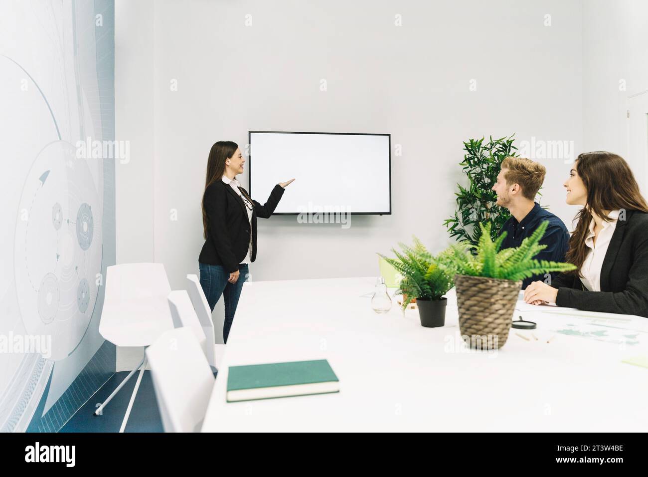 Female employee present staff meeting hi-res stock photography and ...