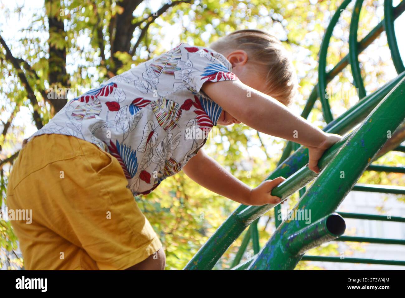 Little children run around and play in the playground. Game center for ...