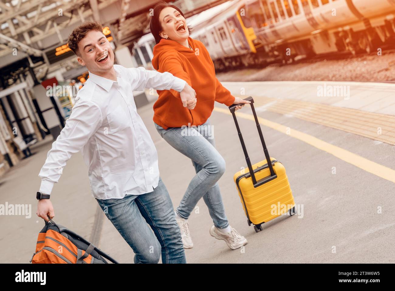 Beautiful couple at railway station waiting for the train. Woman and ...