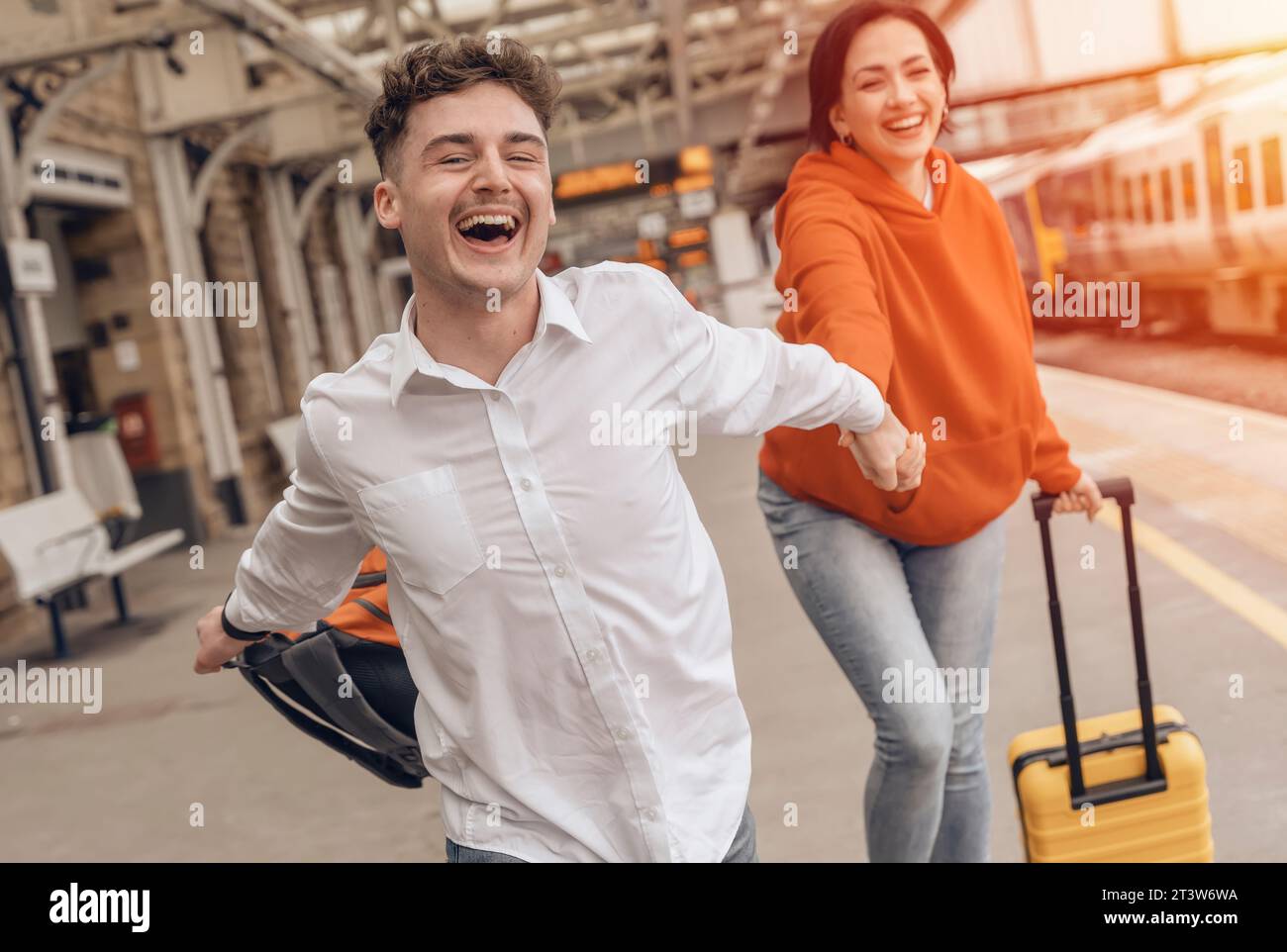 Beautiful couple at railway station waiting for the train. Woman and ...