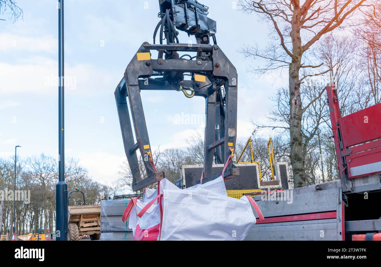 Dropside flatbed HIAB crane lorry with brick grab attachment deliver ...