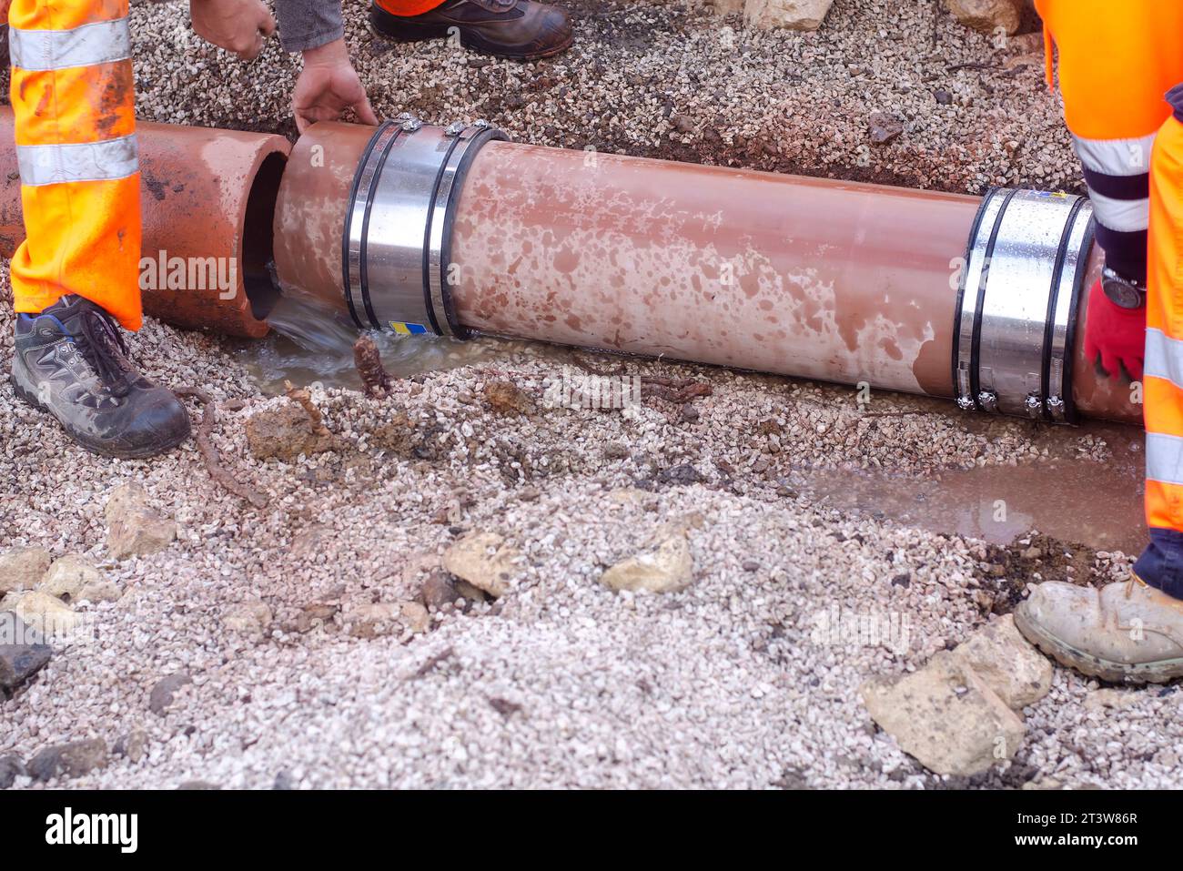 Broken drainage pipe repair Stock Photo - Alamy