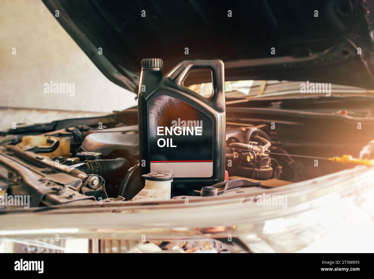 Car engine oil gallon or lubricate oil gallon on car engine compartment ...