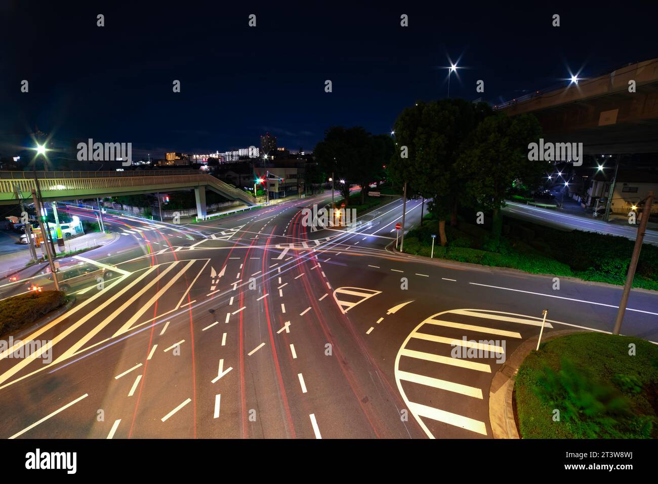 A night timelapse of traffic jam at the city intersection in Tokyo wide ...