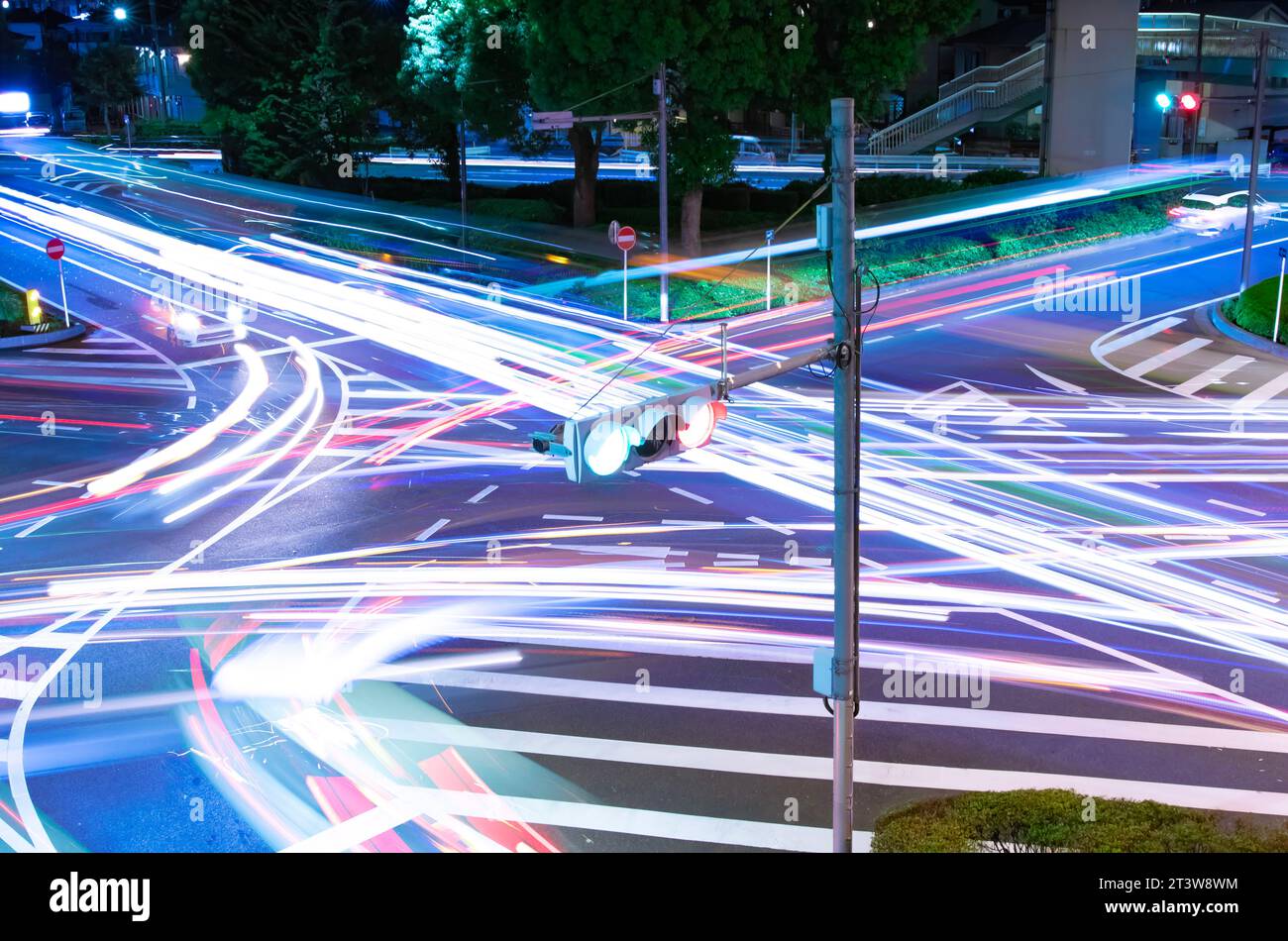 A night timelapse of traffic jam at the city intersection in Tokyo ...