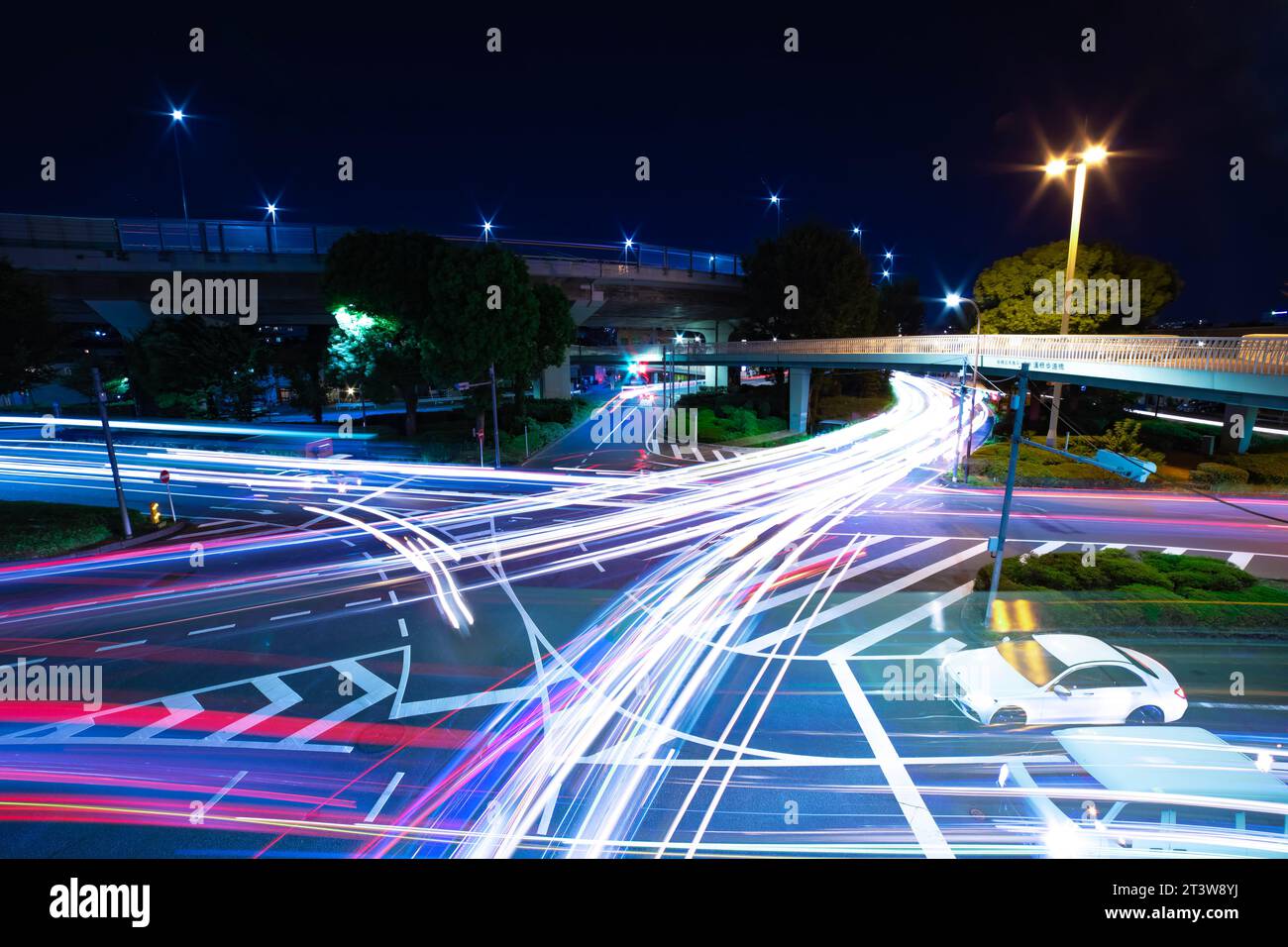 A night timelapse of traffic jam at the city intersection in Tokyo wide ...