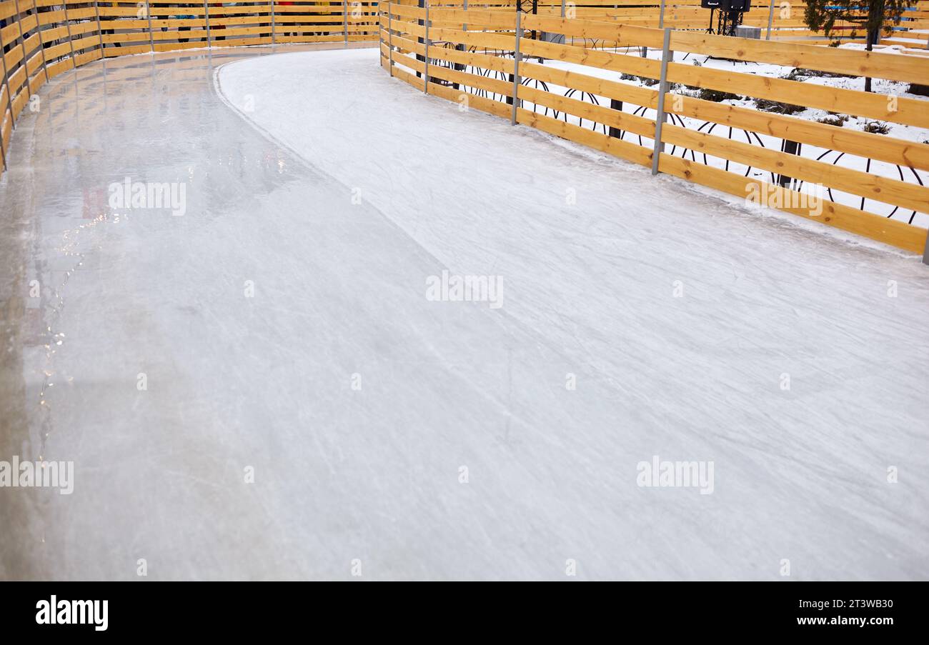 Outdoor skating rink, icy surface. Skating in winter city rink Stock ...