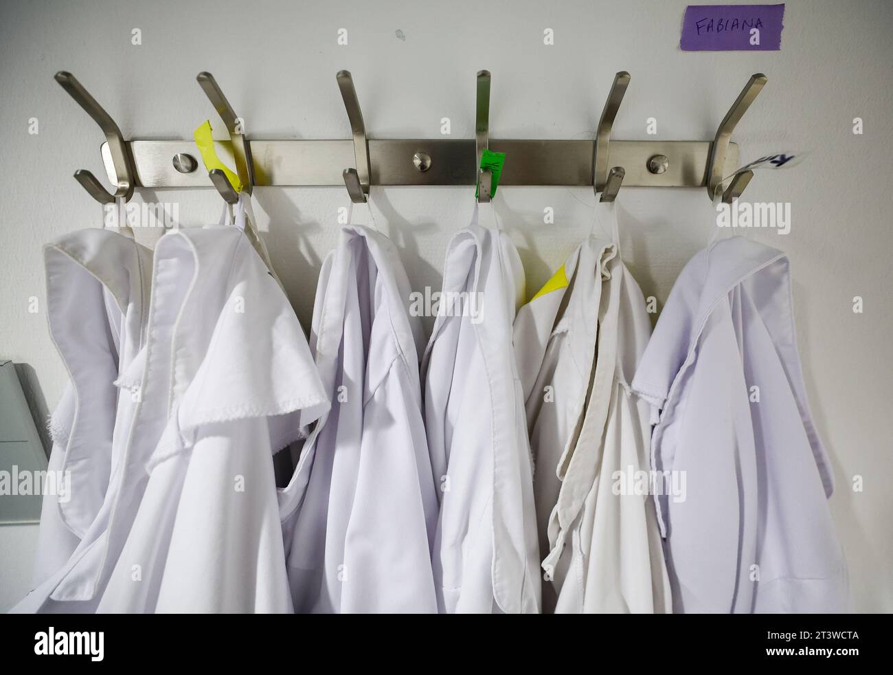 Leipzig, Germany. 26th Oct, 2023. Gowns hang next to a lab at the ...