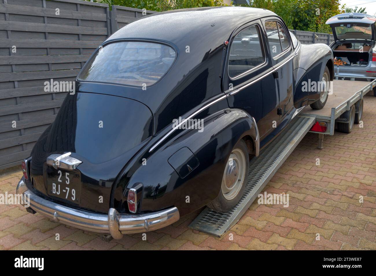 Bordeaux , France - 10 26 2023 : Peugeot 203 black classic retro car go ...