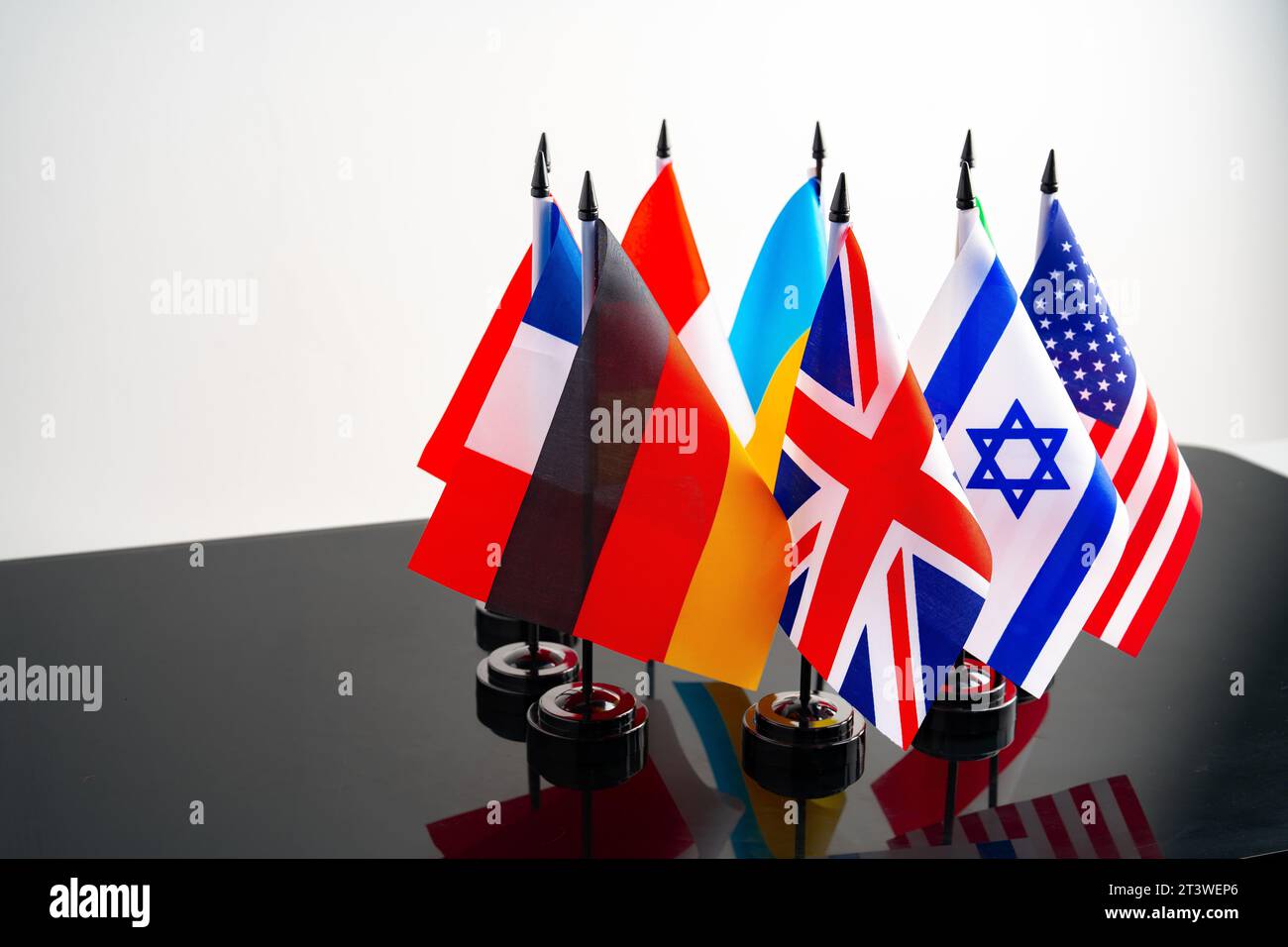 Lots of small national flags on table Stock Photo - Alamy