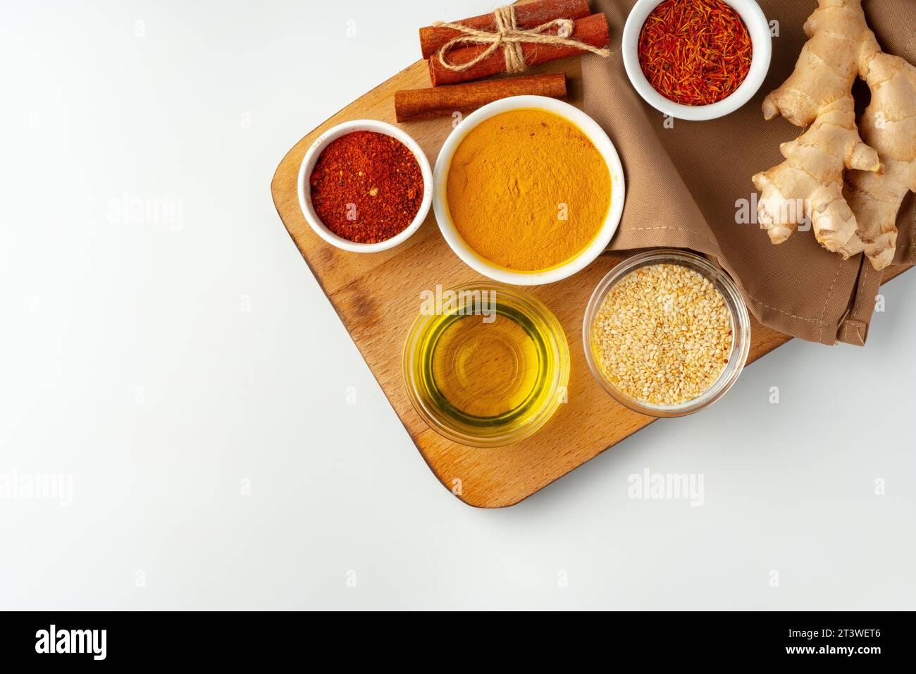 Ginger root and various spices on white background Stock Photo - Alamy