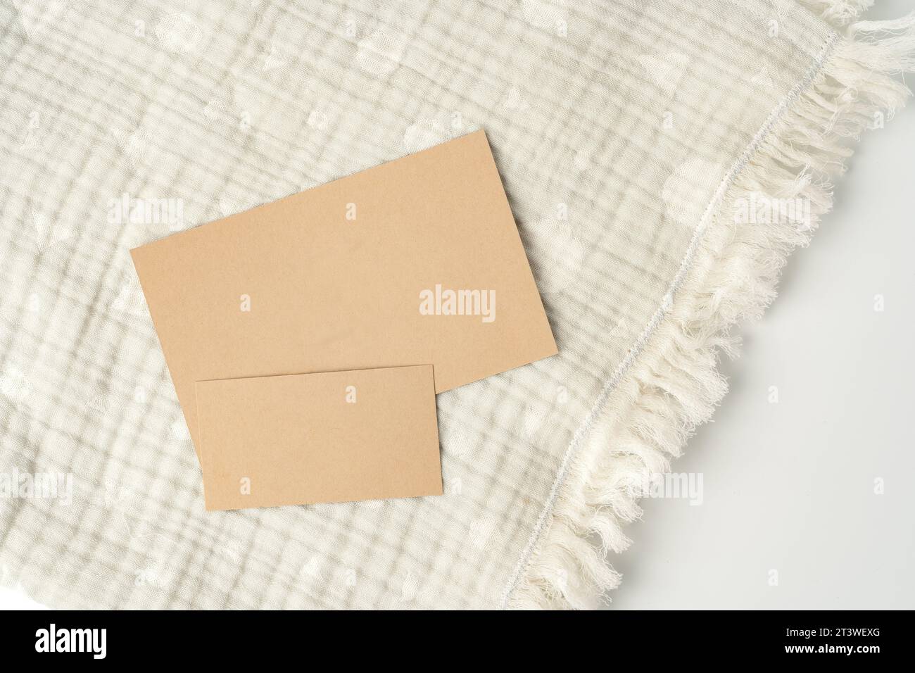 Warm cotton muslin blanket with paper tag on white background Stock ...