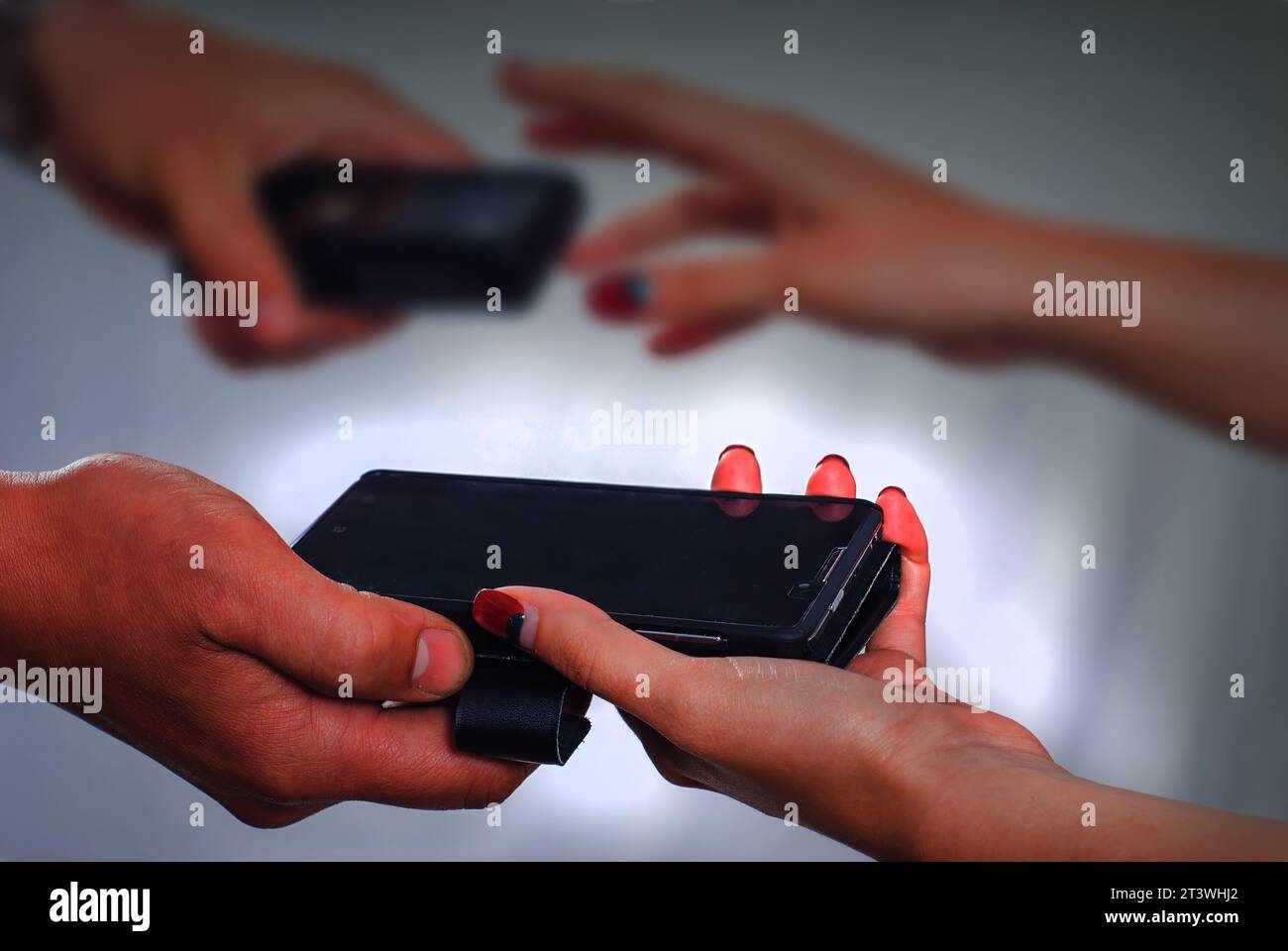 Man and woman exchange smartphones. Innovation conceptual photo Stock ...