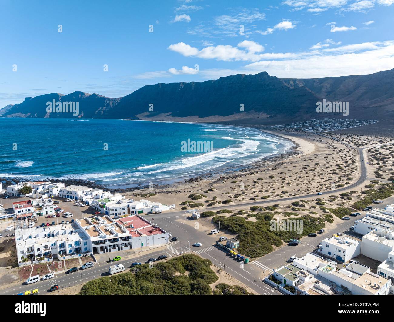 A dramatic view of Famara Beach in Lanzarote, Canary Islands. Volcanic ...