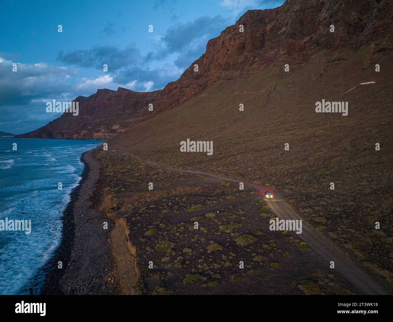 An aerial perspective reveals the hidden beauty of a dirt road snaking ...