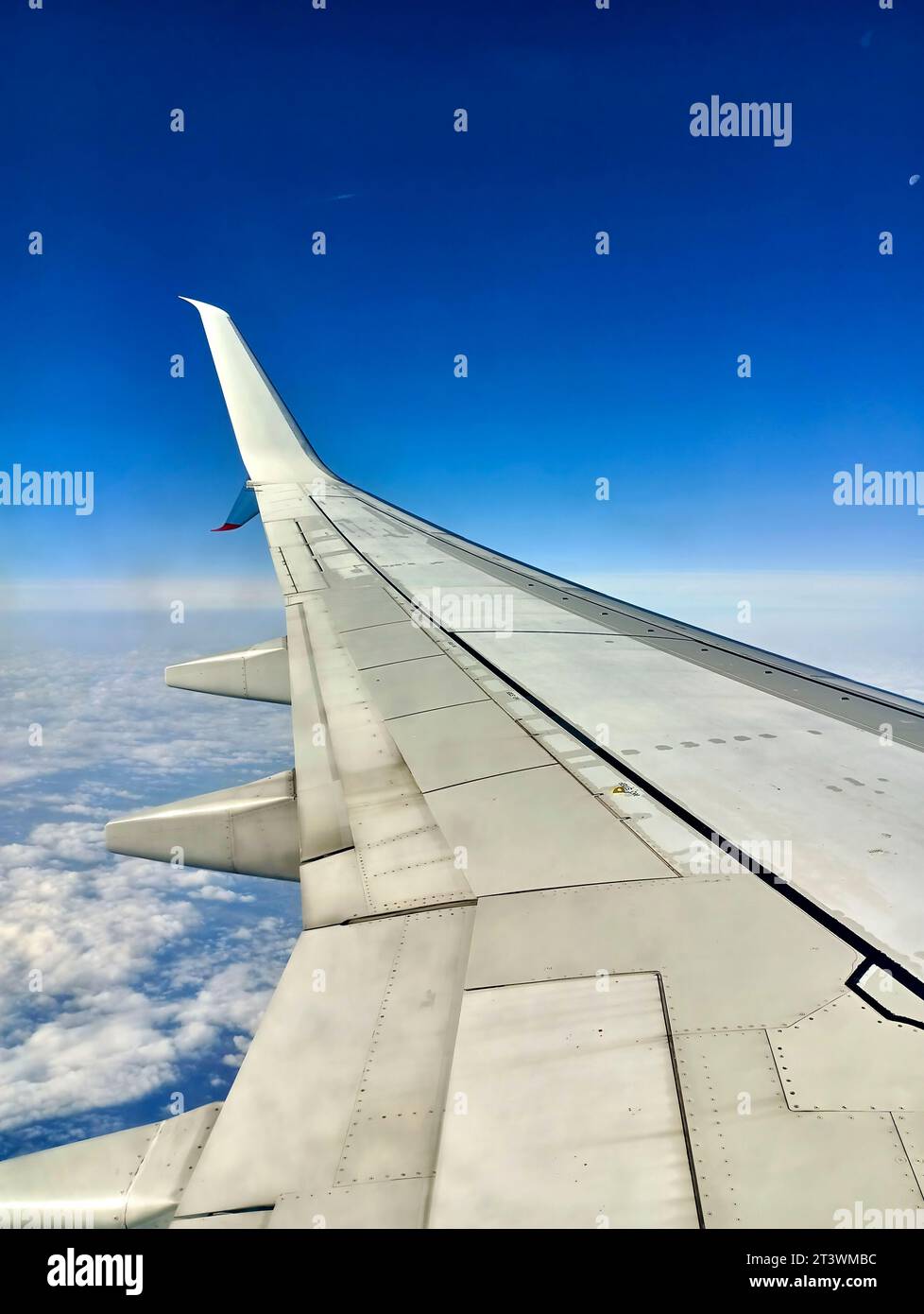 View over the Wing of a Passenger Aircraft from High Altitude on the ...
