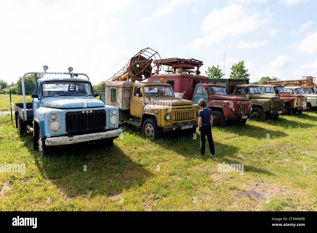 Tourist exploring Museum of old russian vehicles, exhibition of classic ...