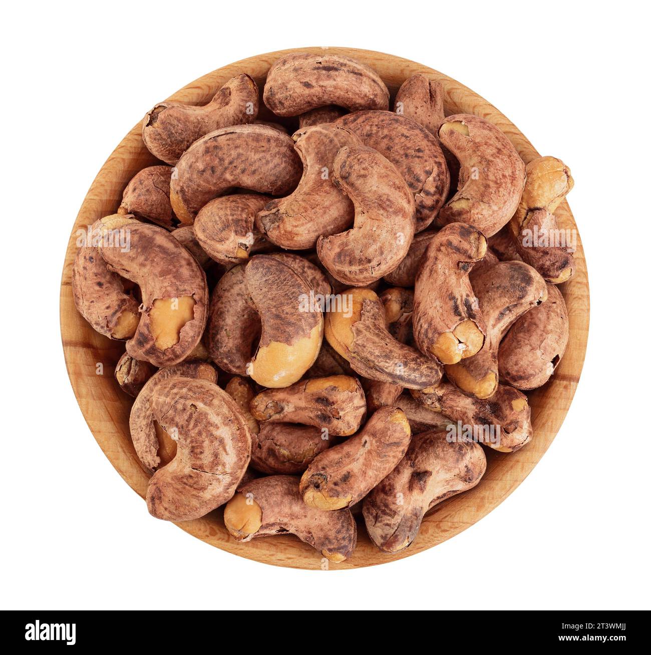 cashew nuts with shell in wooden bowl isolated on white background. Top ...