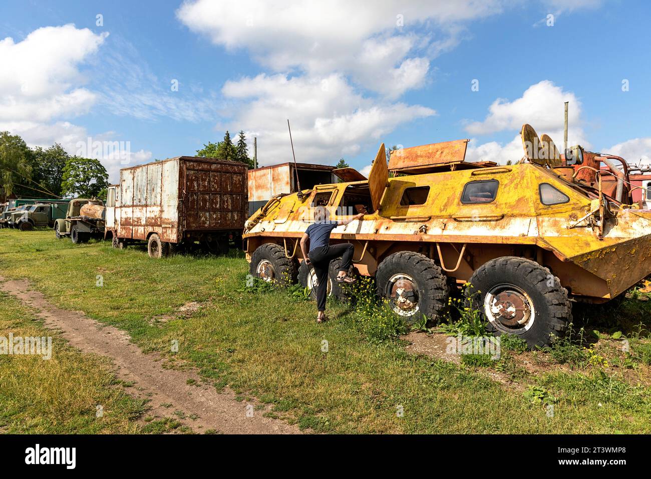Tourist exploring Museum of old russian vehicles, exhibition of classic ...
