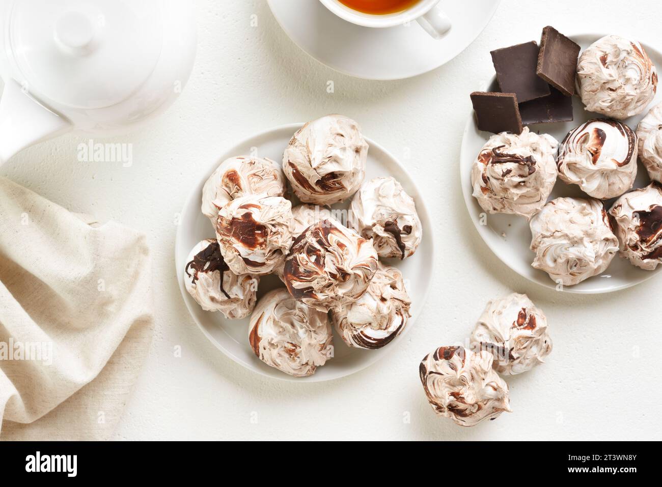 Chocolate meringue cookies over white background. Top view, flat lay ...