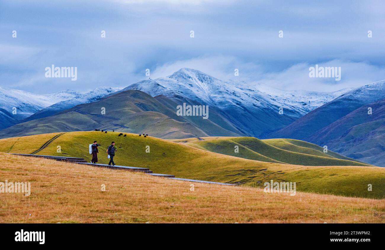 ABA, CHINA - OCTOBER 11, 2023 - Two touriss look at the Langyi Temple ...