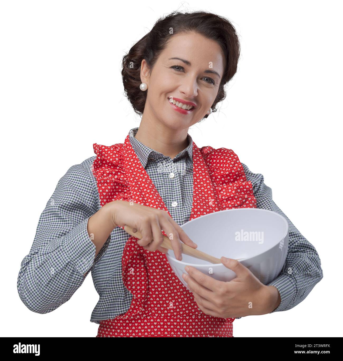 Female vintage cook mixing ingredients in a bowl and smiling Stock ...