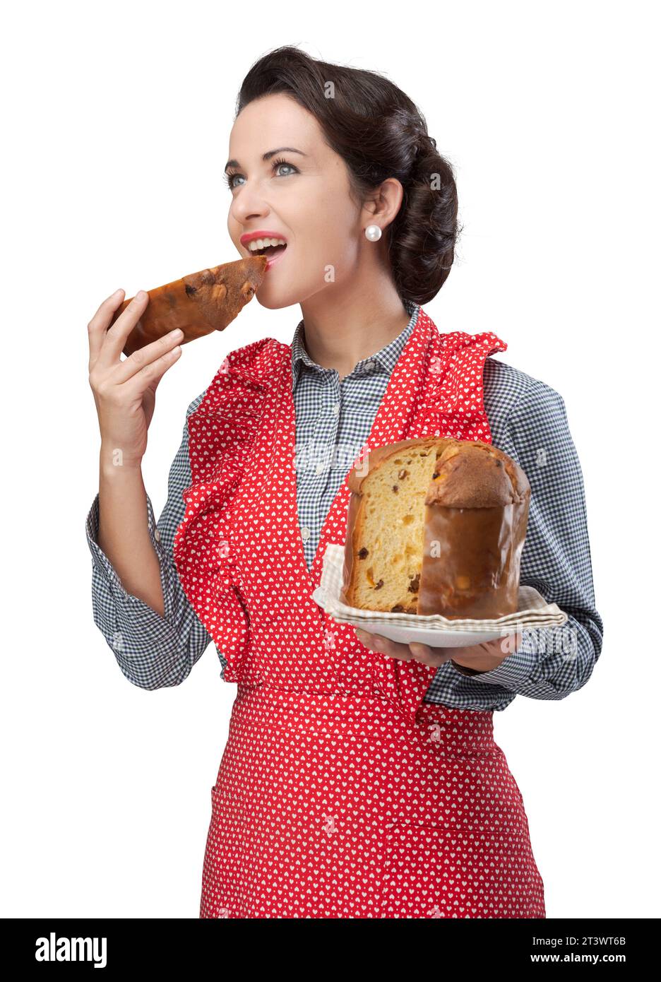 Vintage woman in apron eating a slice of panettone, traditional italian ...