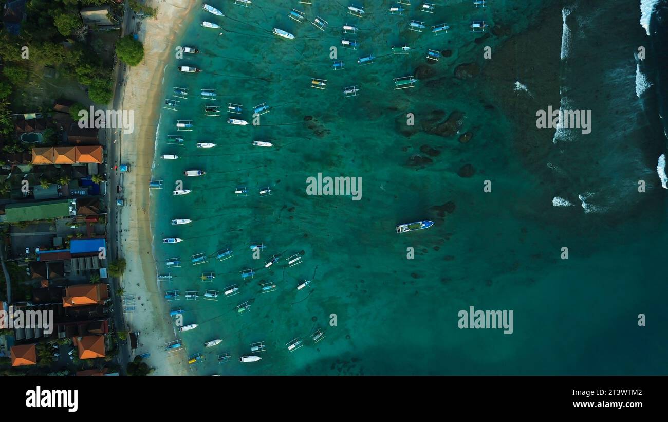Aerial view of Padang Bai port on Bali island. Many small boats on the ...