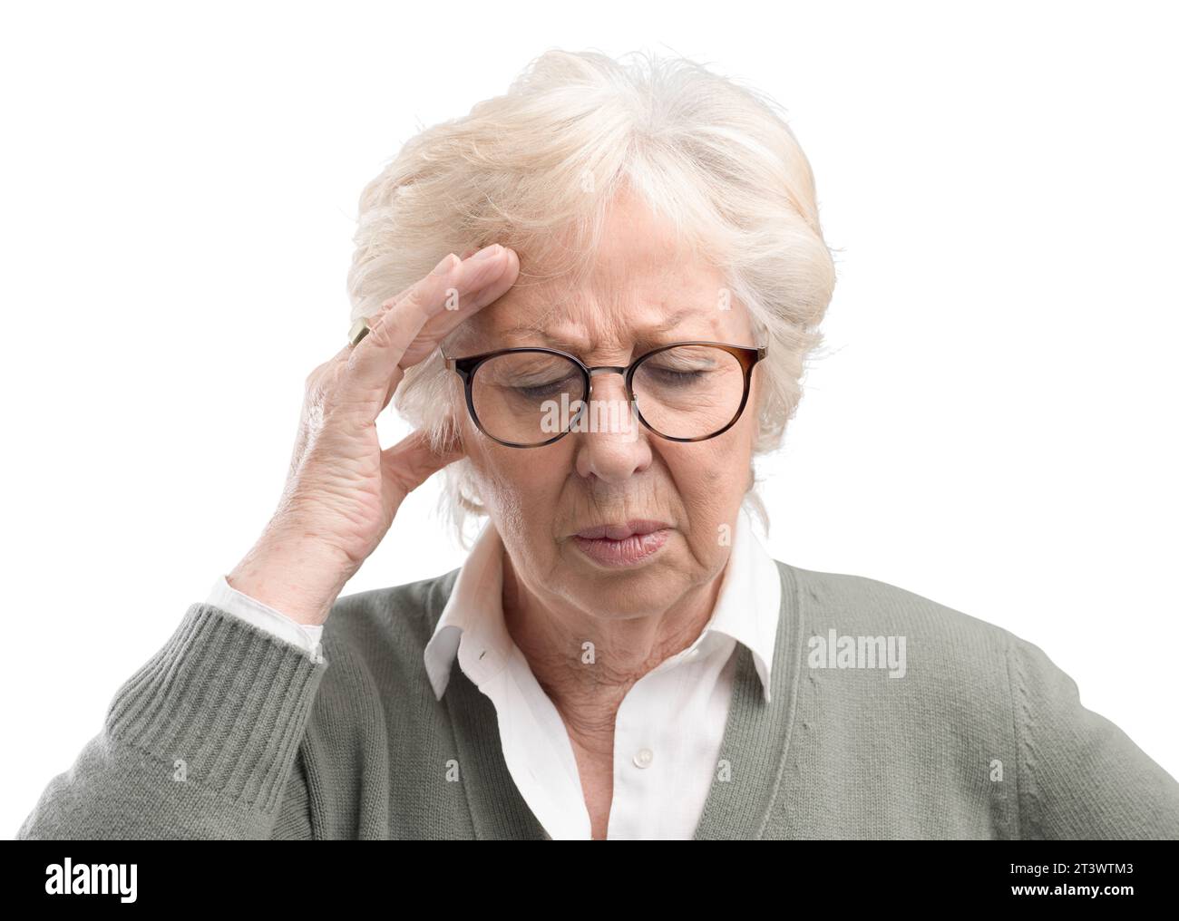 Old woman having a bad headache, she is touching her forehead and ...
