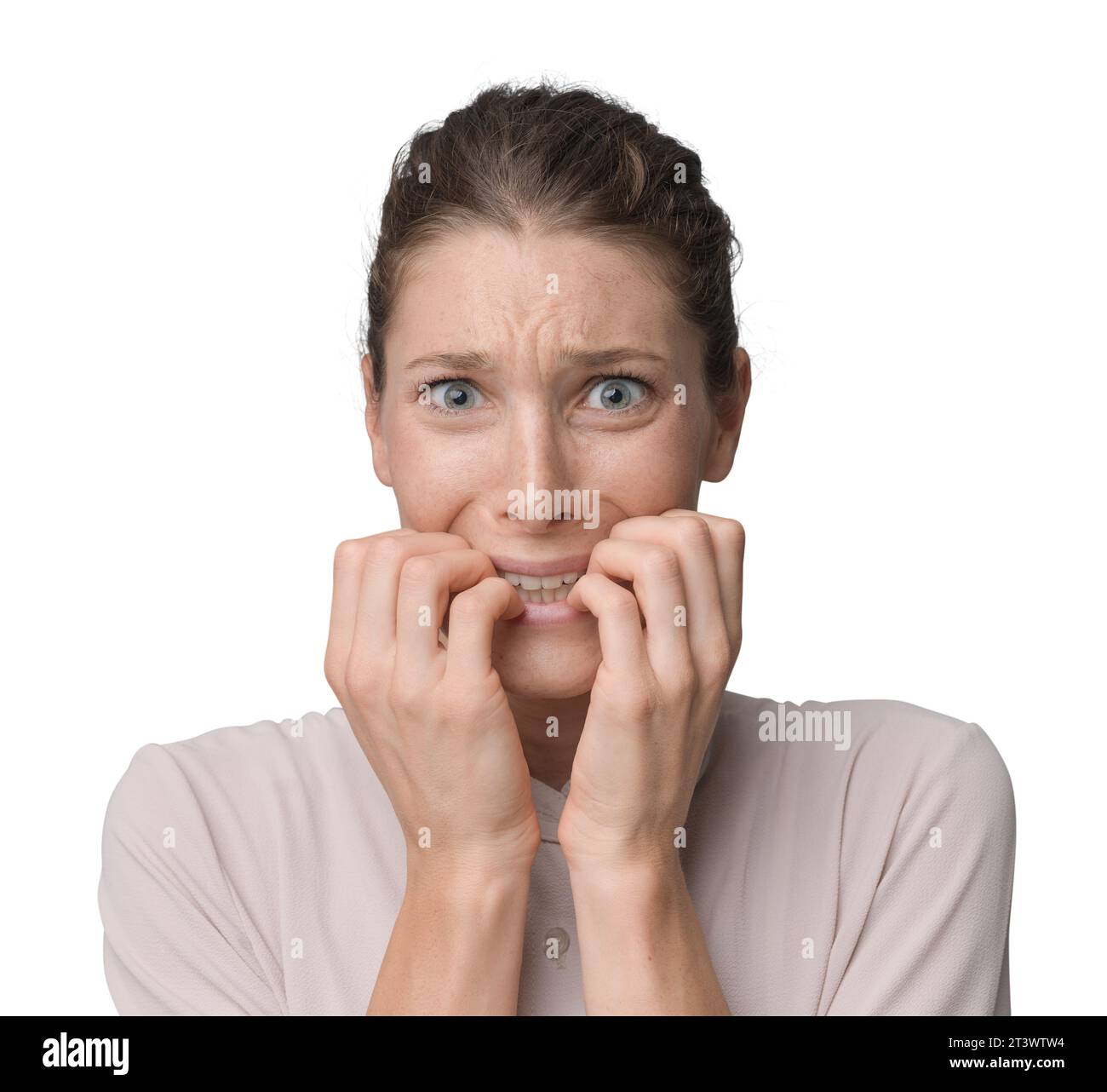 Terrified young woman looking at camera, she is feeling scared and ...