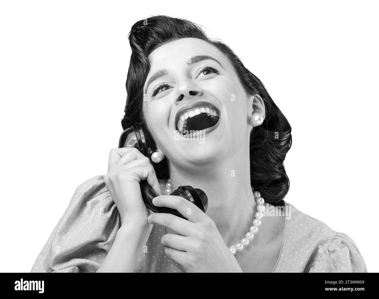 Cheerful vintage style elegant woman having an exciting phone call and ...