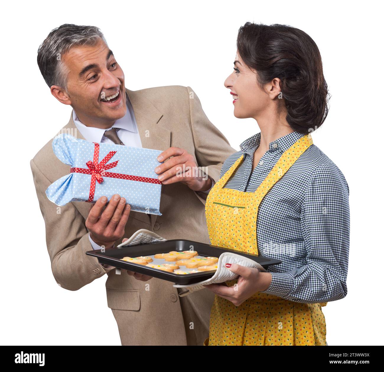 Vintage husband giving a gift to his beautiful wife, she is holding ...