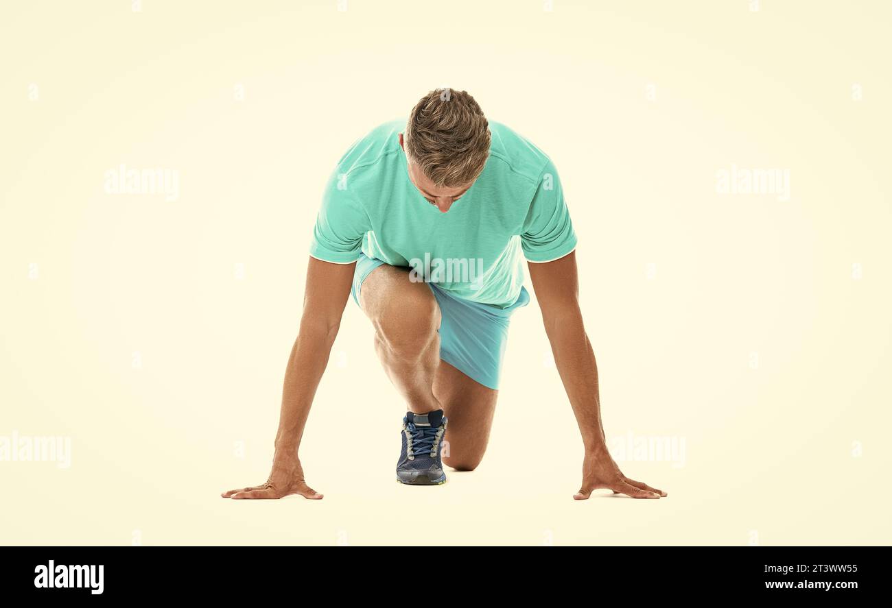 concentrated runner getting ready to start training into action. runner ...