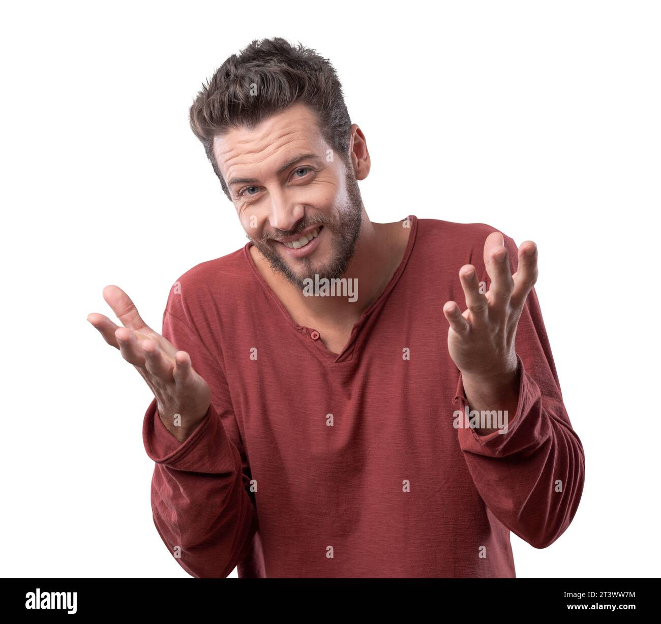 Confused young man shrugging and smiling at camera Stock Photo - Alamy