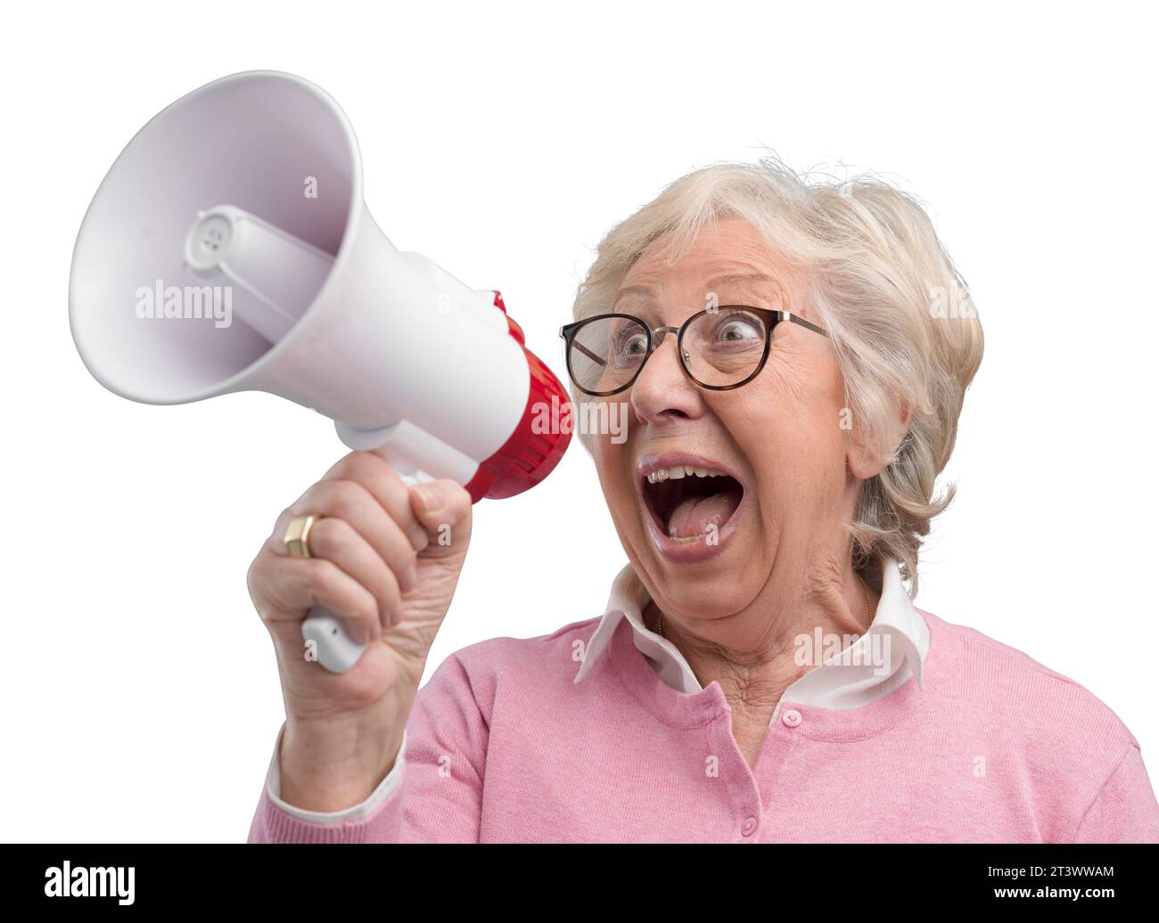 Cheerful senior woman shouting into a megaphone, communication and ...