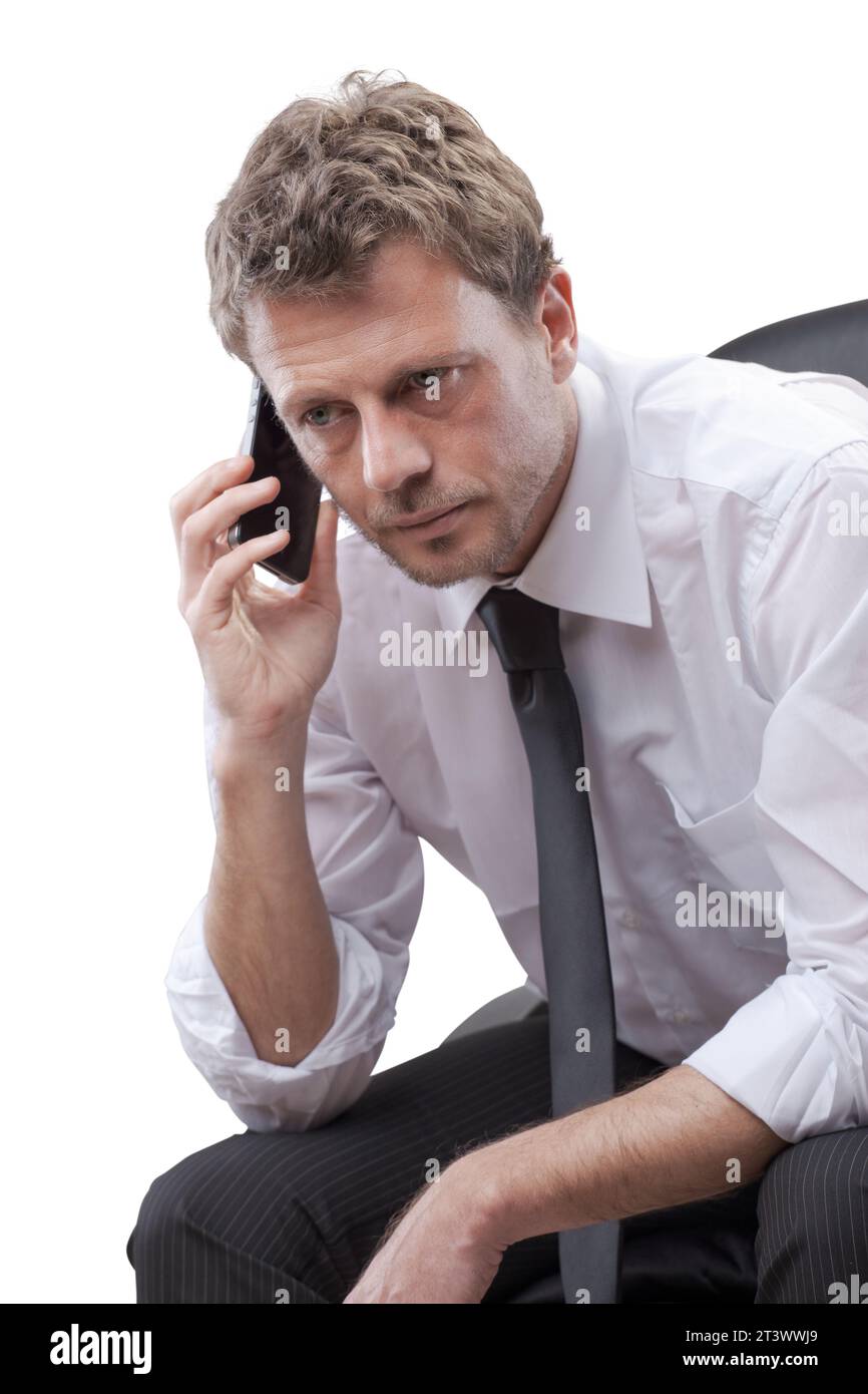 Confident business executive having a phone call with his smartphone ...