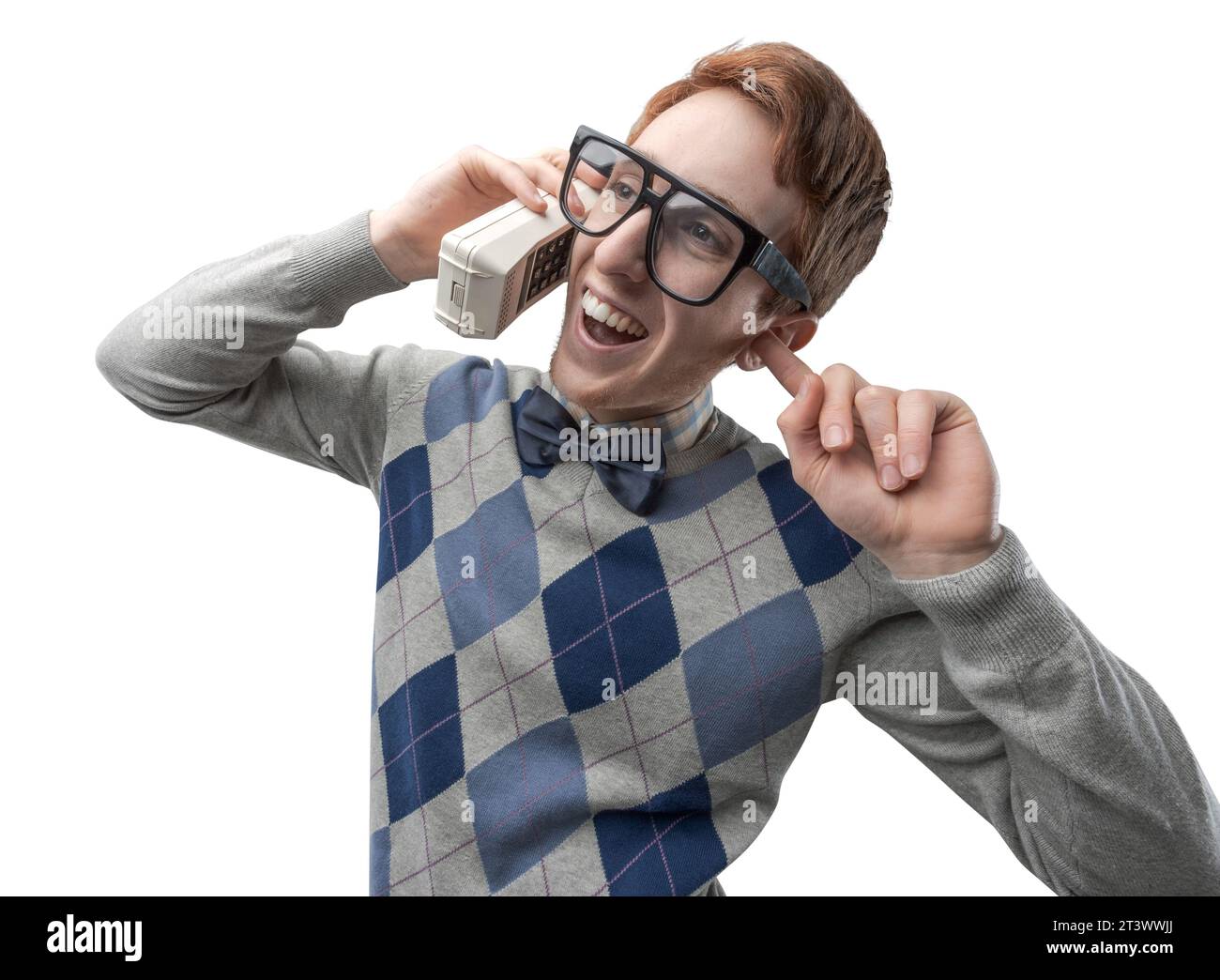 Funny nerd guy with big glasses having a phone call with a cordless ...