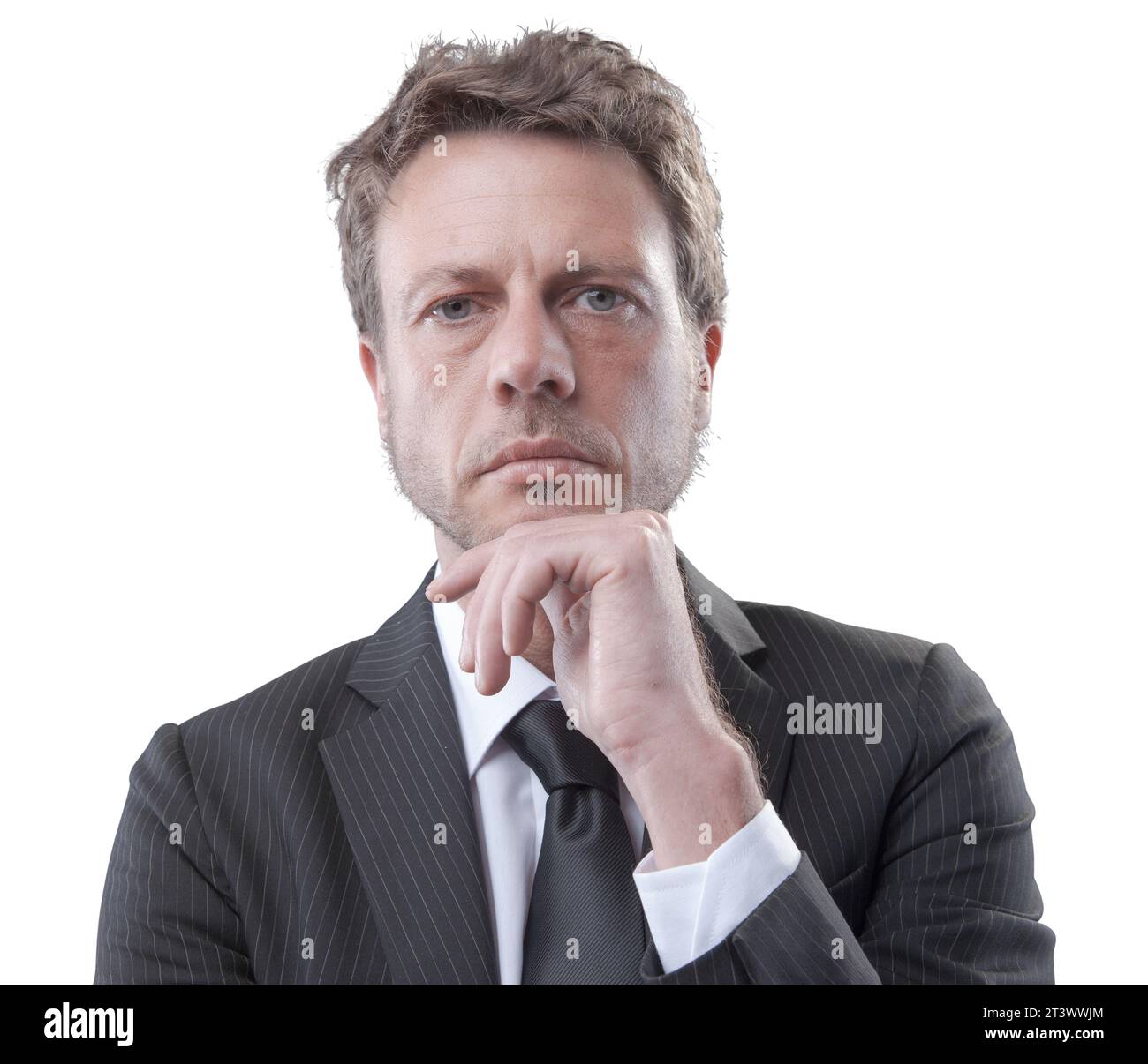 Confident business executive thinking with hand on chin and looking ...