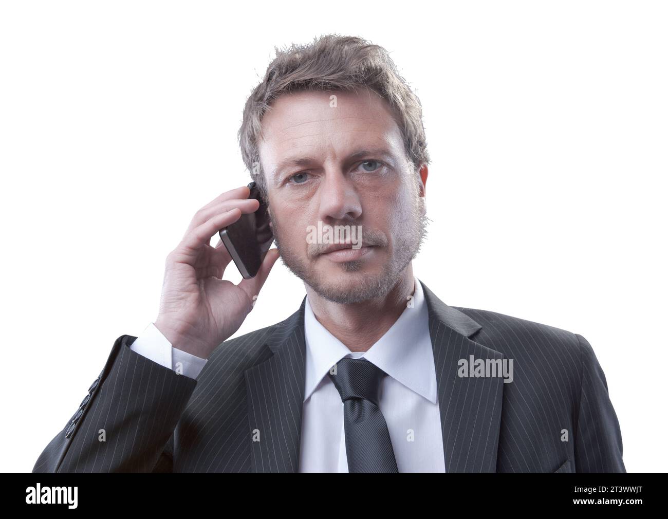 Confident business executive having a phone call with his smartphone ...