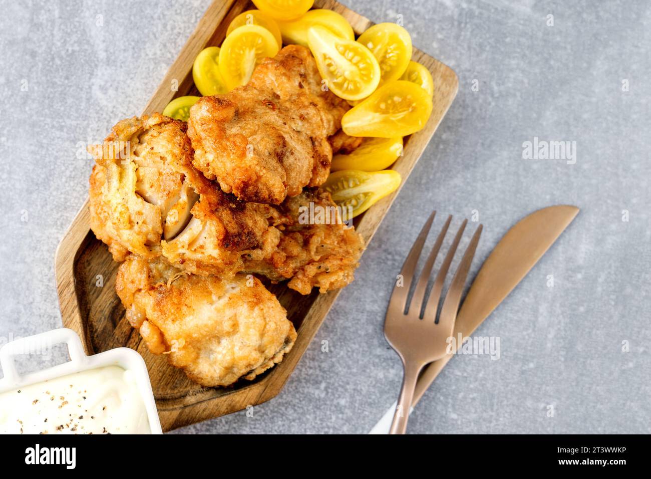 The fish dish is fried cod fillet with a creamy sauce and yellow plum ...