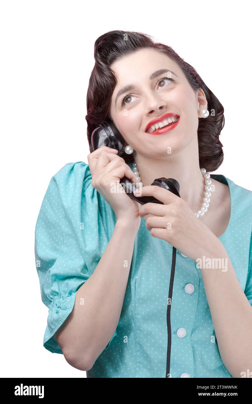 Vintage style woman holding the receiver and having a phone call, she ...